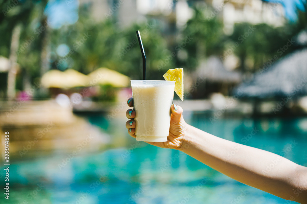 Woman Holding Out Pina Colada Drink At Resort Swimming Pool Stock Photo ...