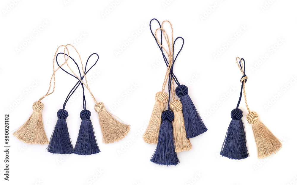 Blue and golden silk tassels isolated on white background for creating ...