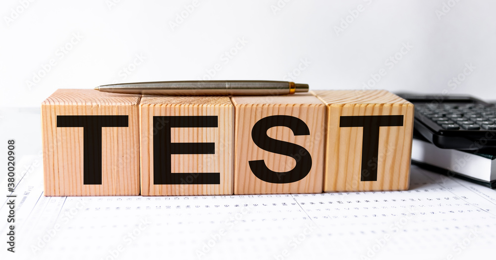 Test word made of wood background. Business concept. Test sign, exam ...
