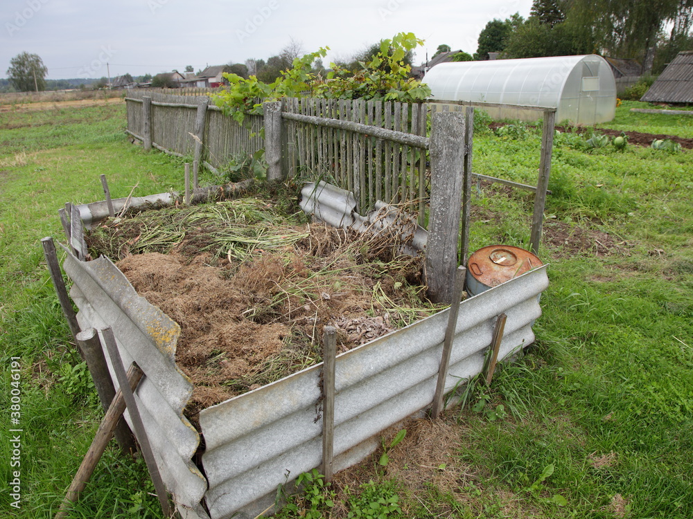 Compost heap close up, humus warm garden bed on backyard on wooden ...