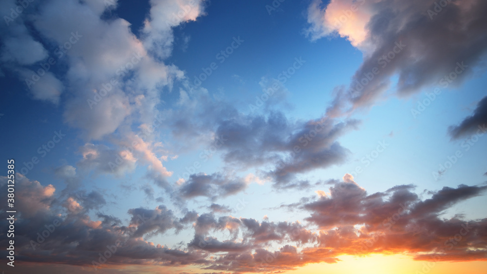 Clear blue sunset sky with colorful cumulus clouds. Abstract natural ...