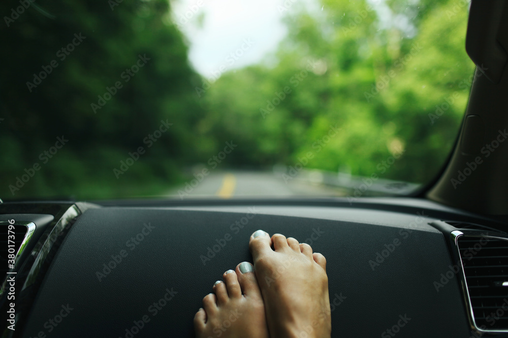 woman's feet on the dashboard of a car during a road trip Stock Photo ...