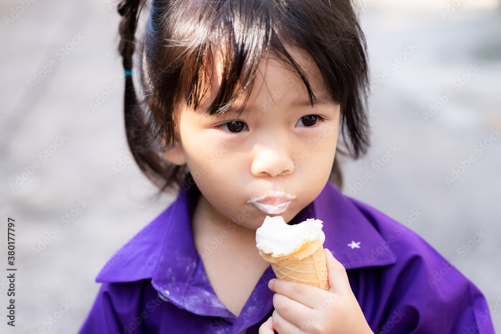 Preschooler was eating a white ice cream be sloppy on her lips. Child ...