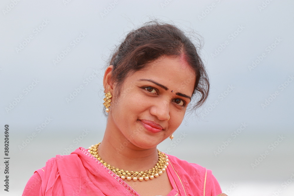 outdoors portrait of a indian lady with happy face. Facial glow and ...
