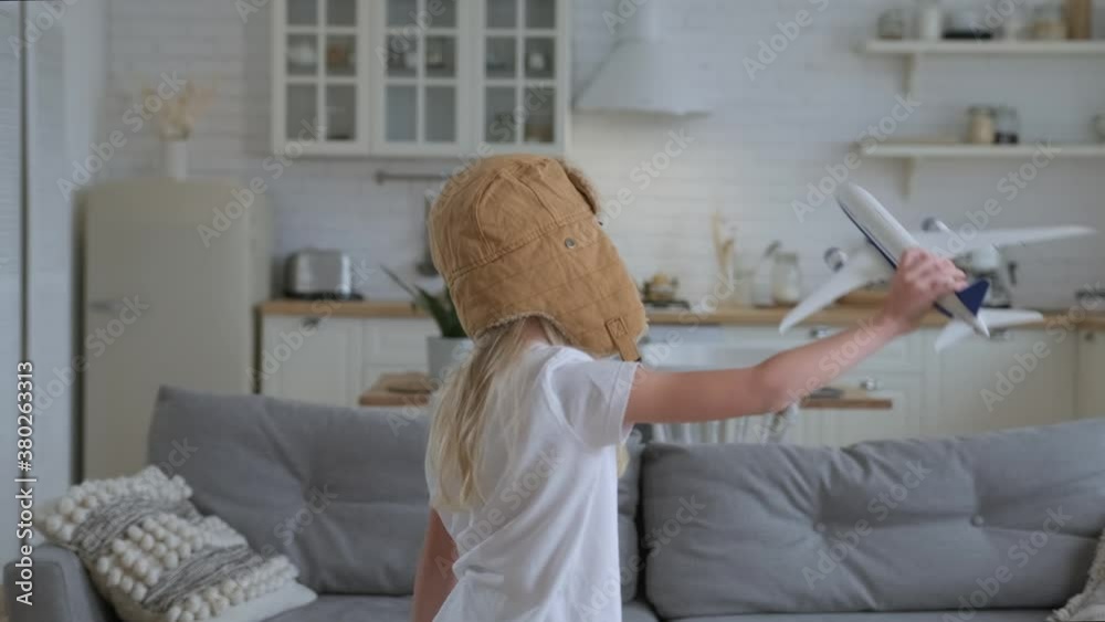 Travel conception. Girl imagines herself as an aircraft pilot child's ...