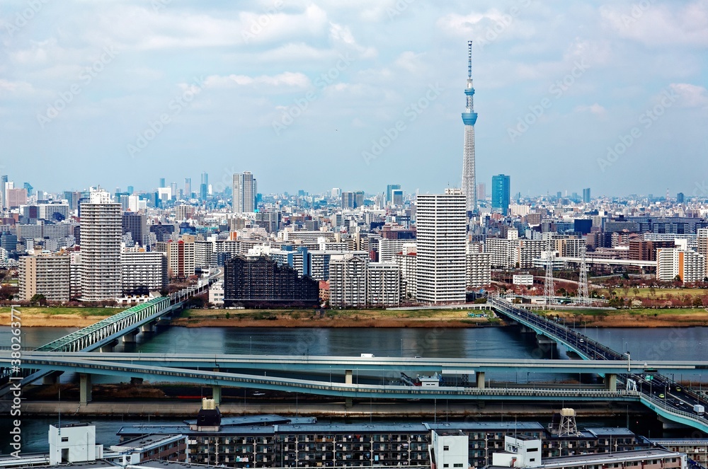A panoramic view of Tokyo City skyline under sunny sky, with bridges ...