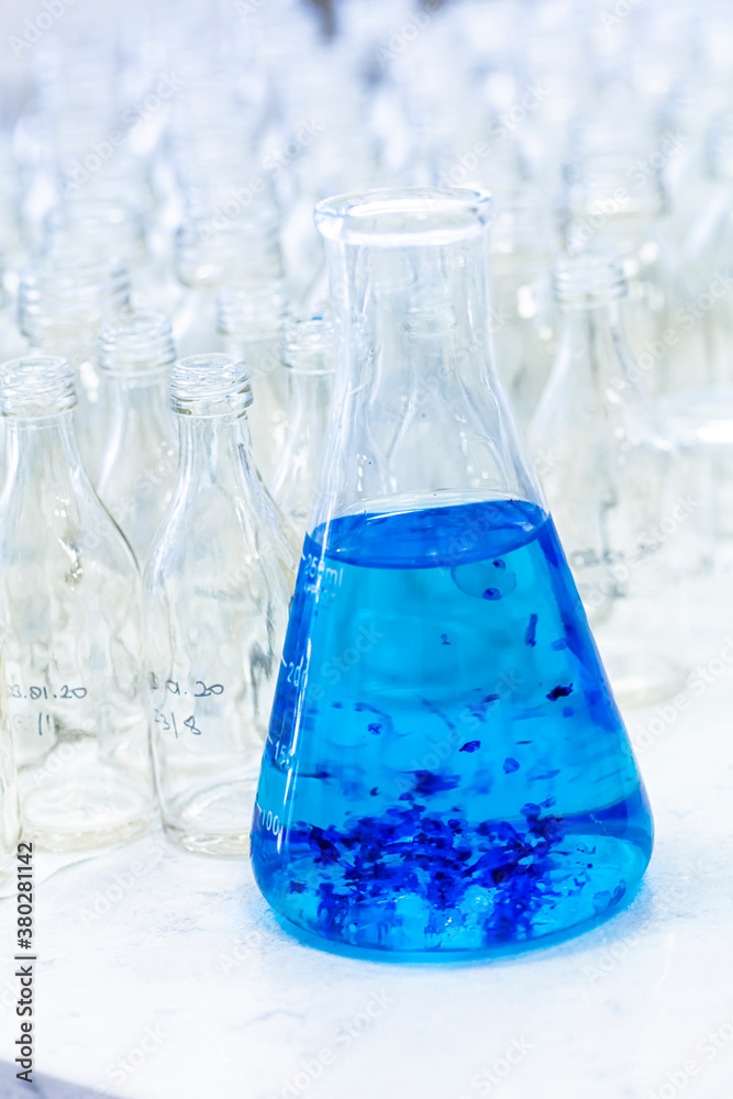 blue solution (methylene blue) in erlenmeyer, experiments in chemistry ...