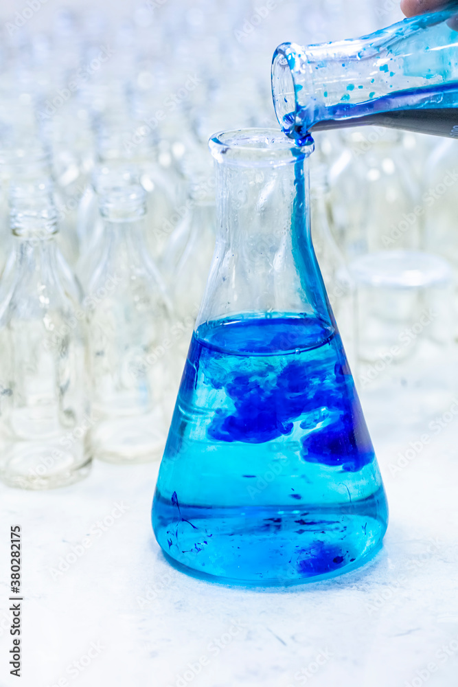 blue solution (methylene blue) in erlenmeyer, experiments in chemistry ...