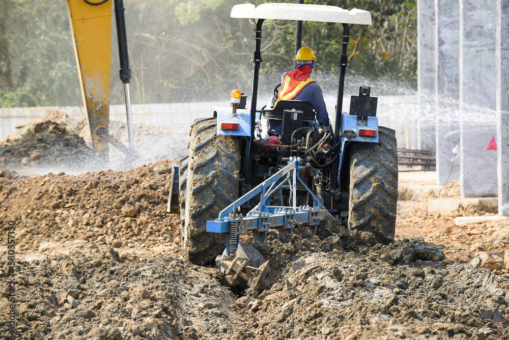 Soil improvment or soil cement mixing with water by tractors plowing ...