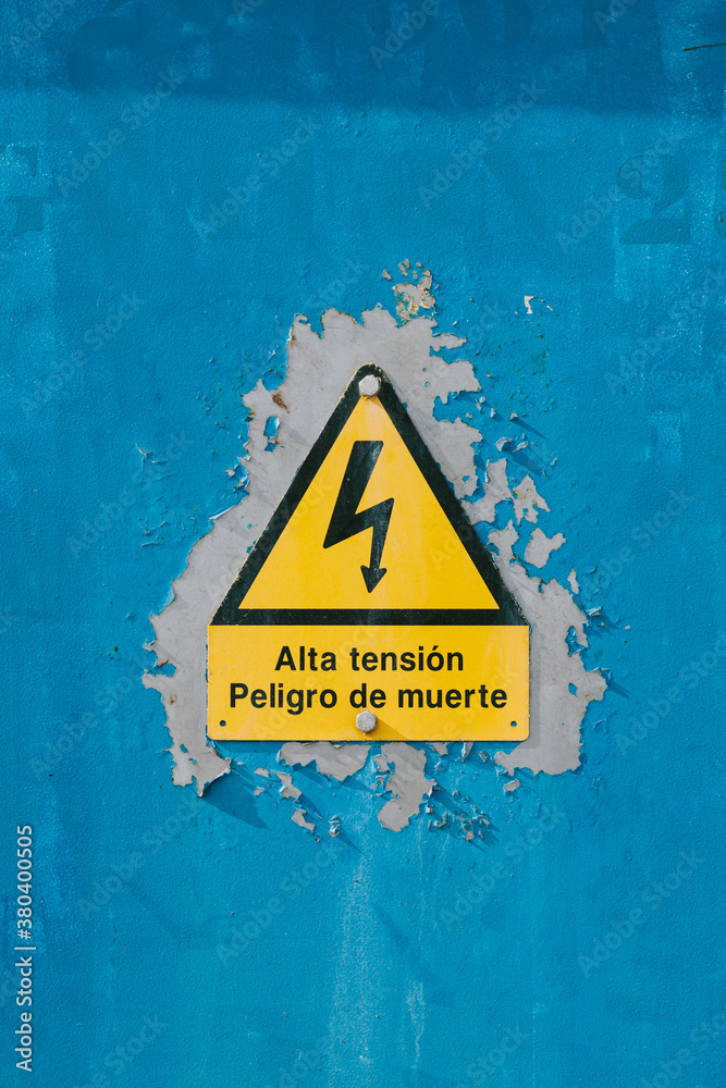 High Voltage Sign over a Rusty Blue Background Stock Photo | Adobe Stock