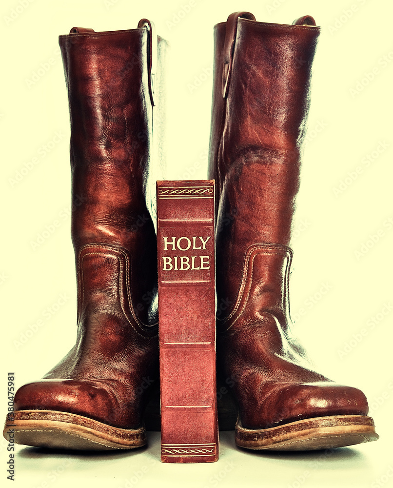 Bible and boots on gray background Stock Photo | Adobe Stock