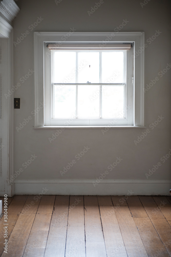 square window empty room interior wooden floorboards and grey wall ...