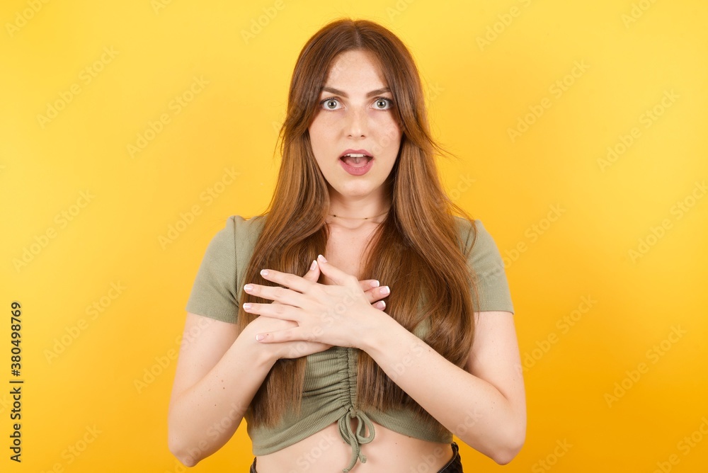 Scared Arab female isolated over white background looks with frightened ...