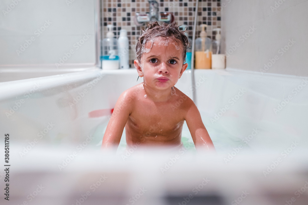 Angry girl having a bath Stock Photo | Adobe Stock