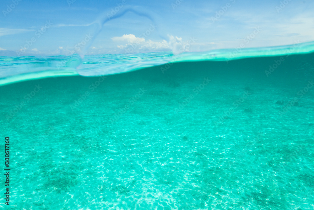 Emty half turquoise tropical sea water half blue sky background Stock ...
