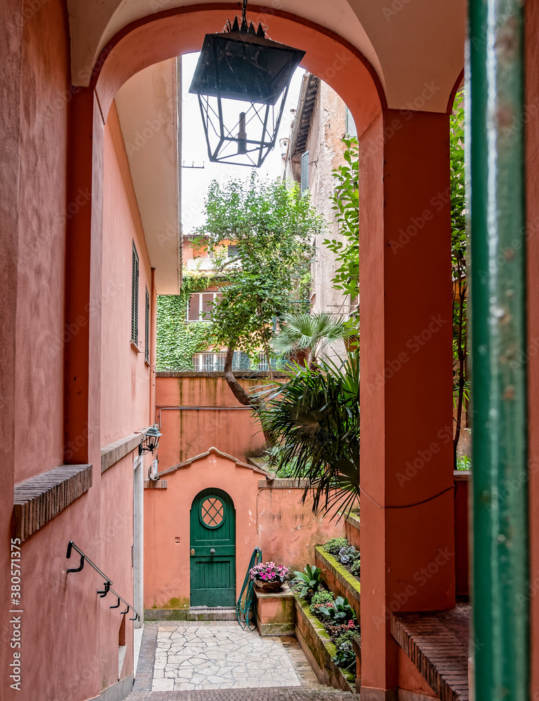 vintage house colorful entrance gate with flowers and green doors, Rome ...