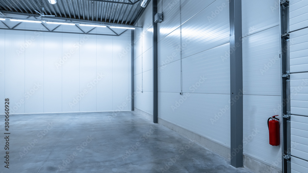 Shot of a Lit Empty Warehouse with Gray Concrete Floor, White Metall ...