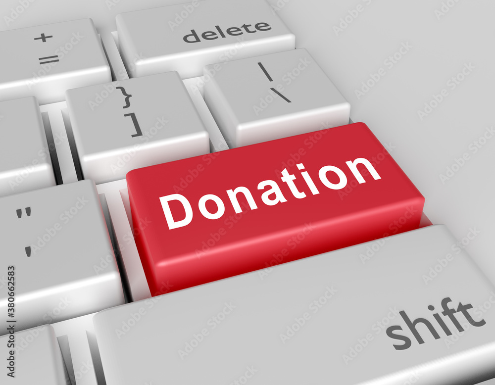 Word Donation is written on a computer keyboard. Conceptual image on a ...