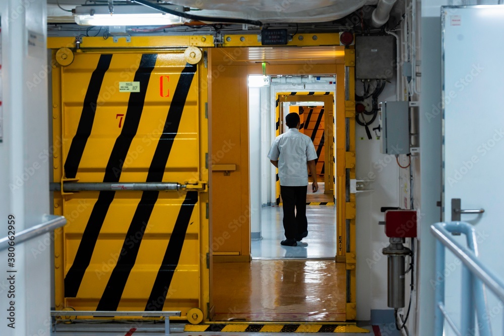 Crew members of a notorious cruise ship company working onboard while ...