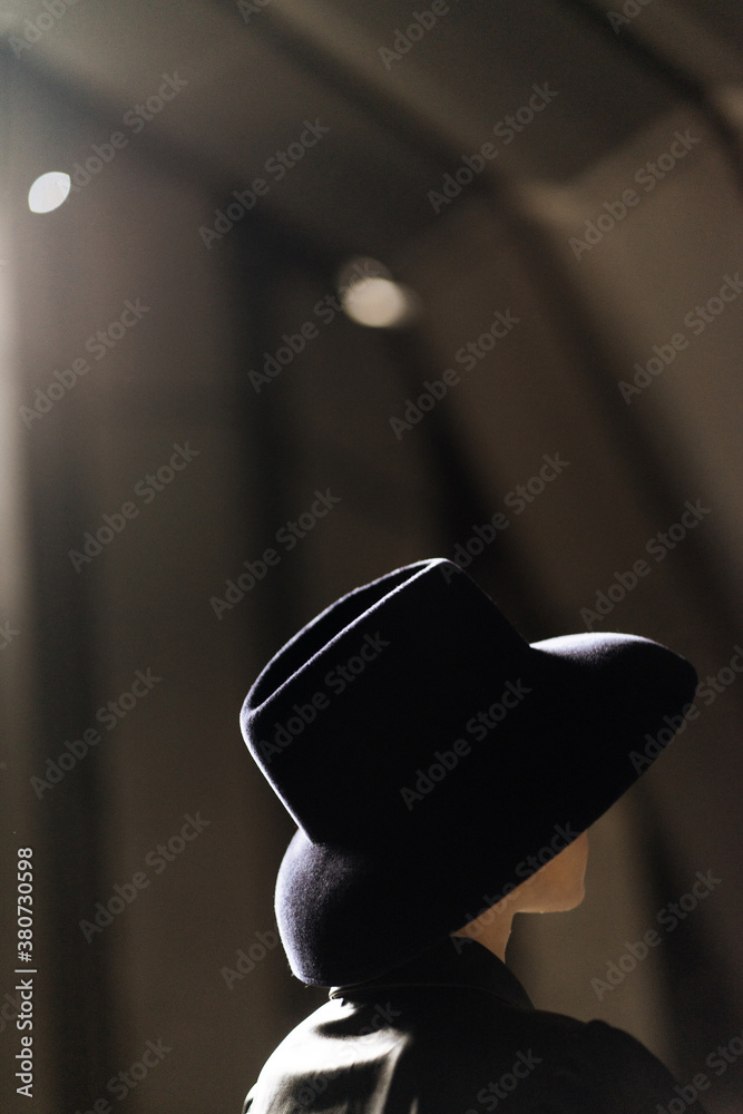 girl without face in a stylish hat and backlight Stock Photo | Adobe Stock