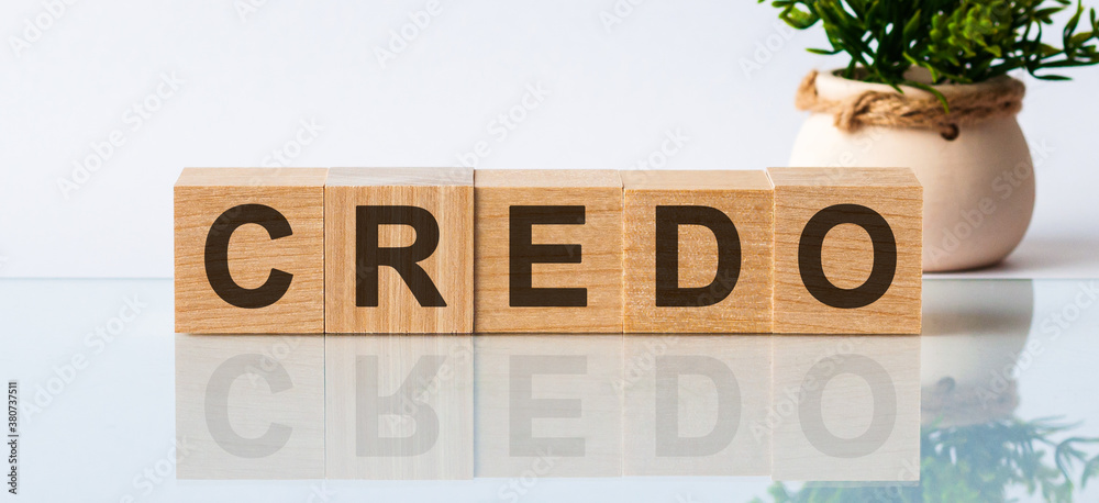 Word credo. Wooden small cubes with letters isolated on white ...