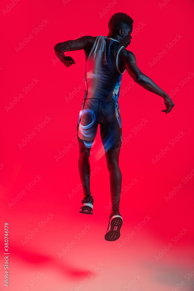 Full body back view of professional young African American sportsman in ...