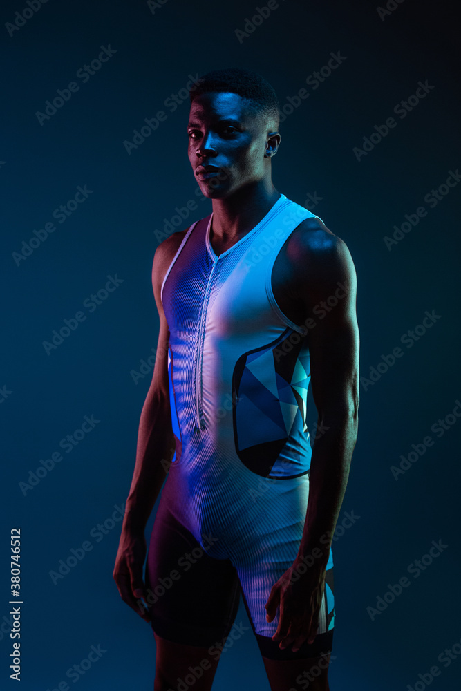 Side view of serious concentrated young African American male athlete ...