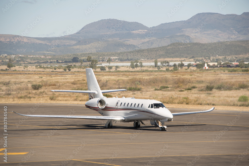 Exclusive private jet plane preparing for takeoff Stock Photo | Adobe Stock