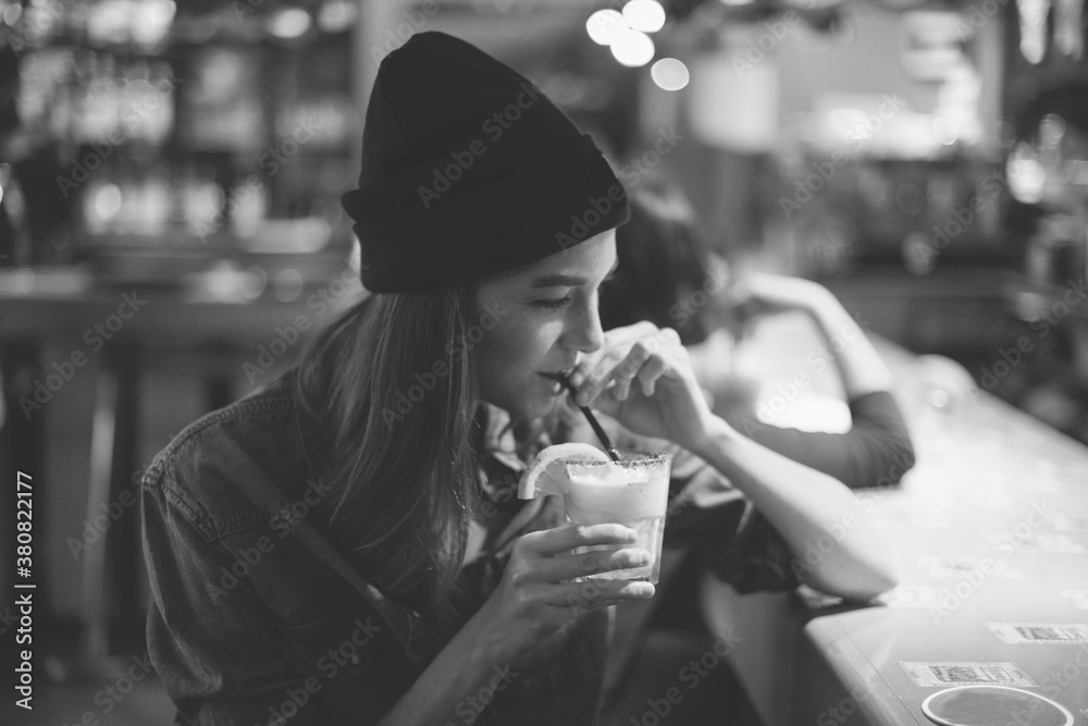 Young girl drinking alcoholic drink Stock Photo | Adobe Stock