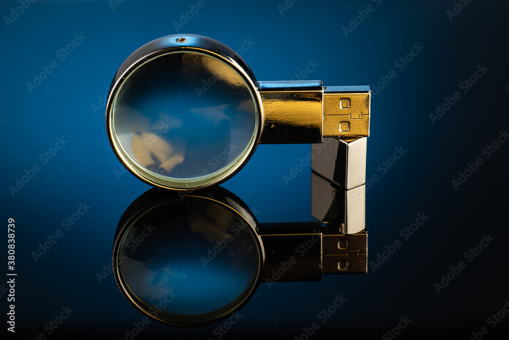 a magnifying glass, a magnifier in a metal case with a built-in flash ...