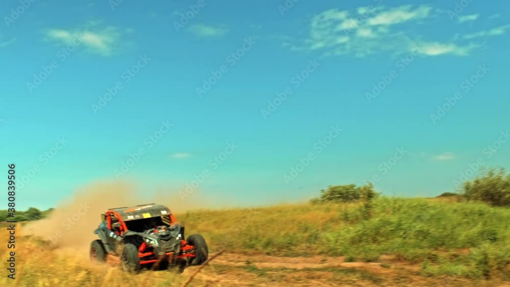 Buggy car going fast in cross country road. Fast rally auto is going ...