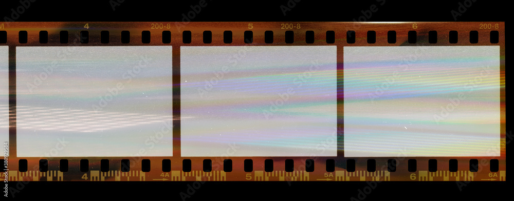 35mm negative filmstrip with empty cells, first frame on white ...