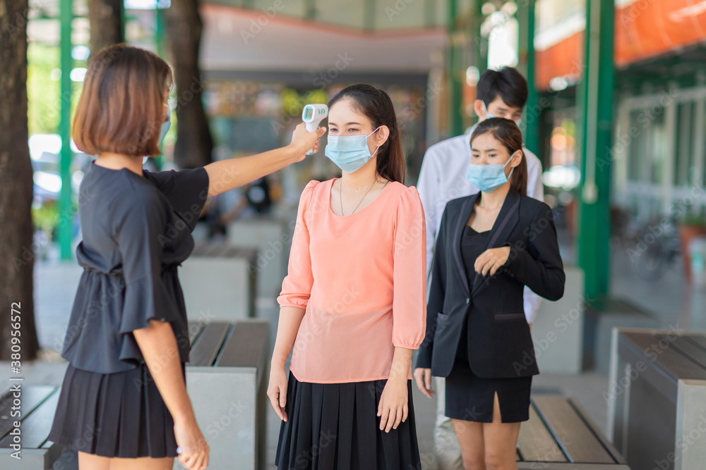 Visitors must go through fever measures using infrared digital ...