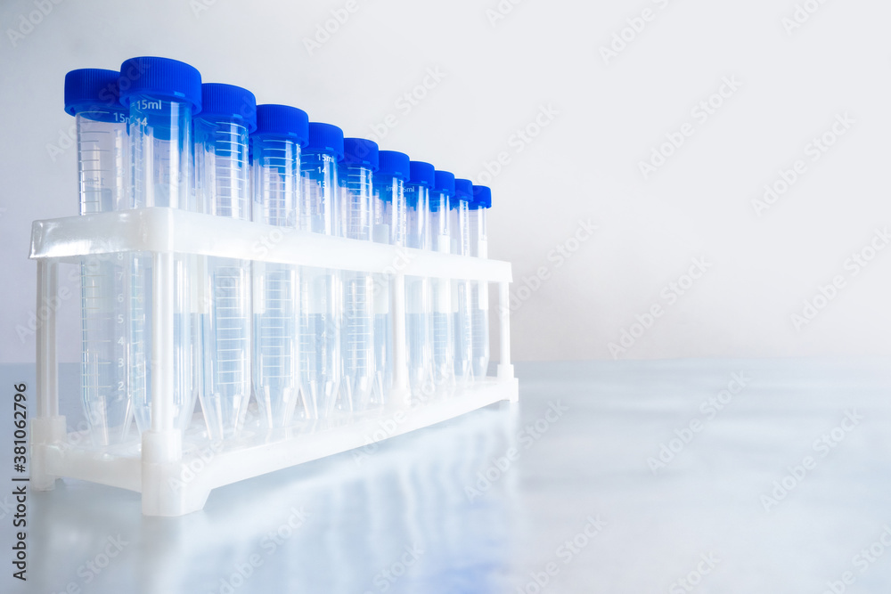 Empty plastic test tubes on table. Disposable medical utensils ...