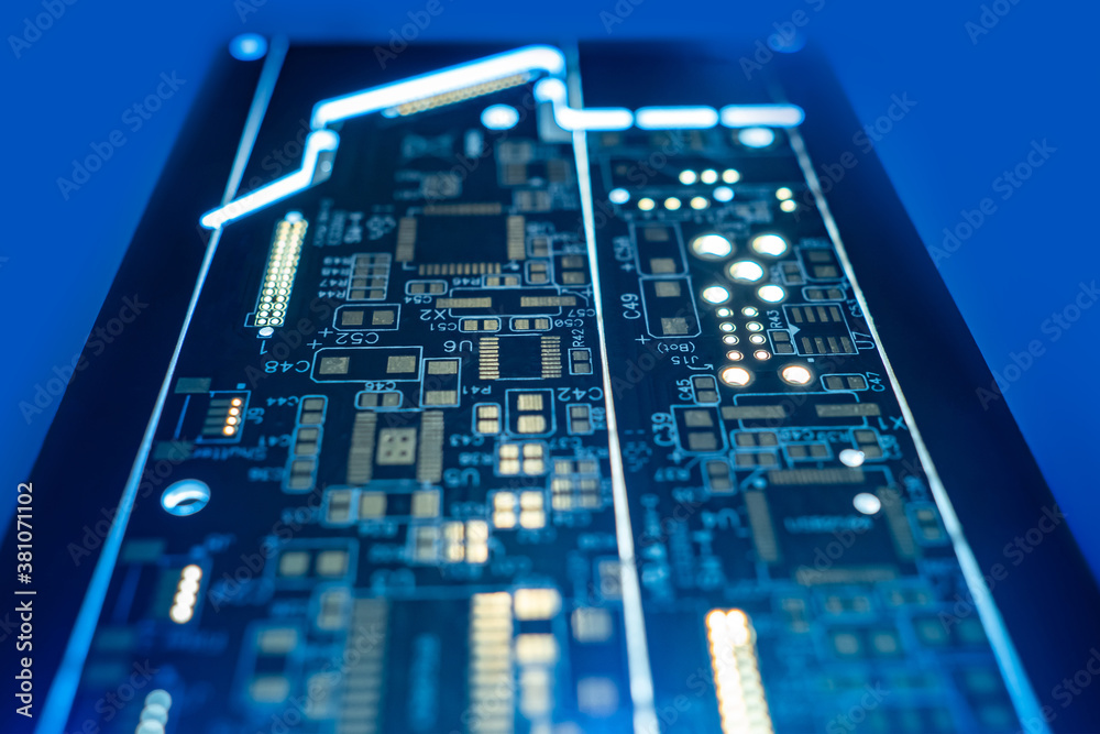 PCB board in blue background. High-tech electronic printed circuit ...