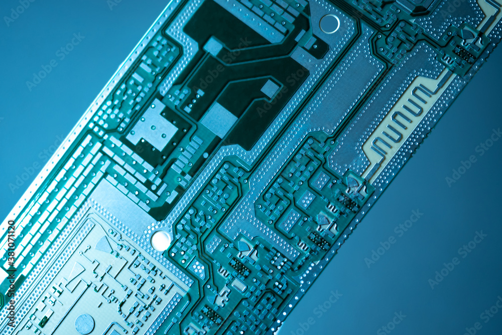 Microboard on a dark background. PCB board without processors and ...