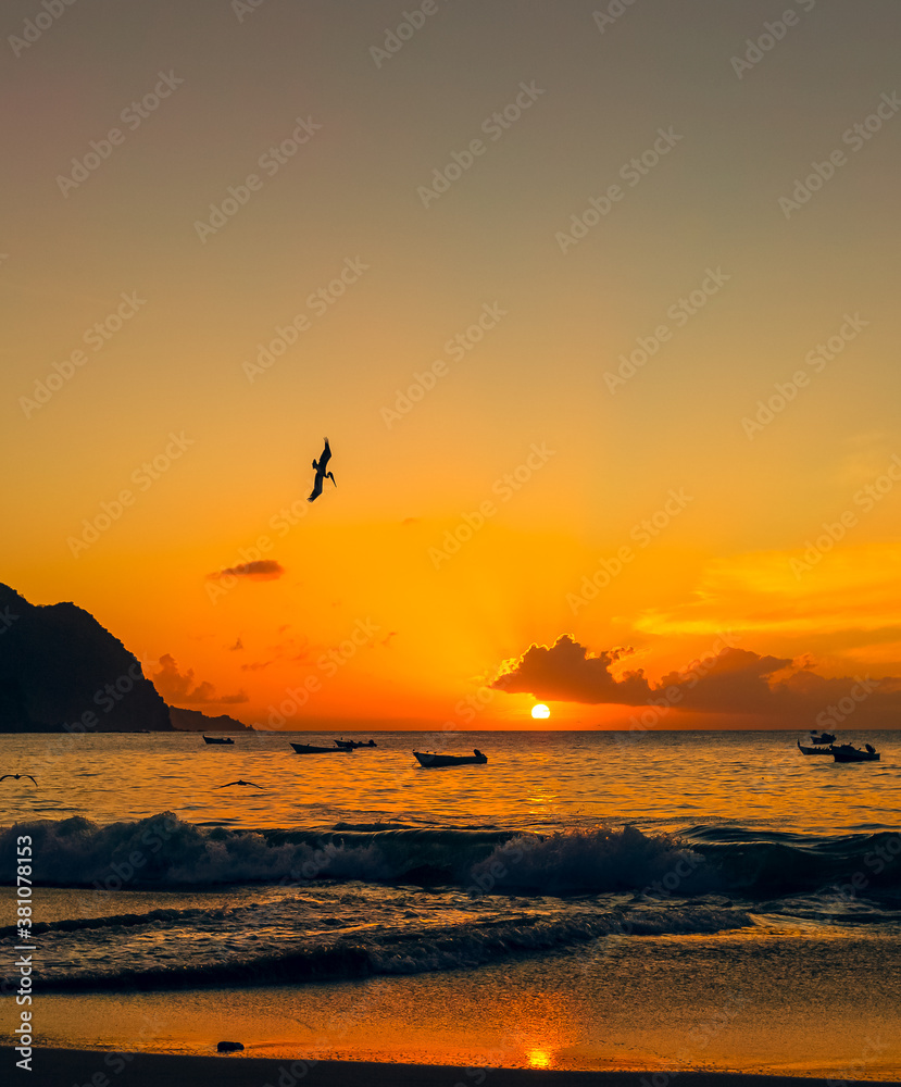 Tobago sunset over the calm seas of this small, Caribbean island. With ...