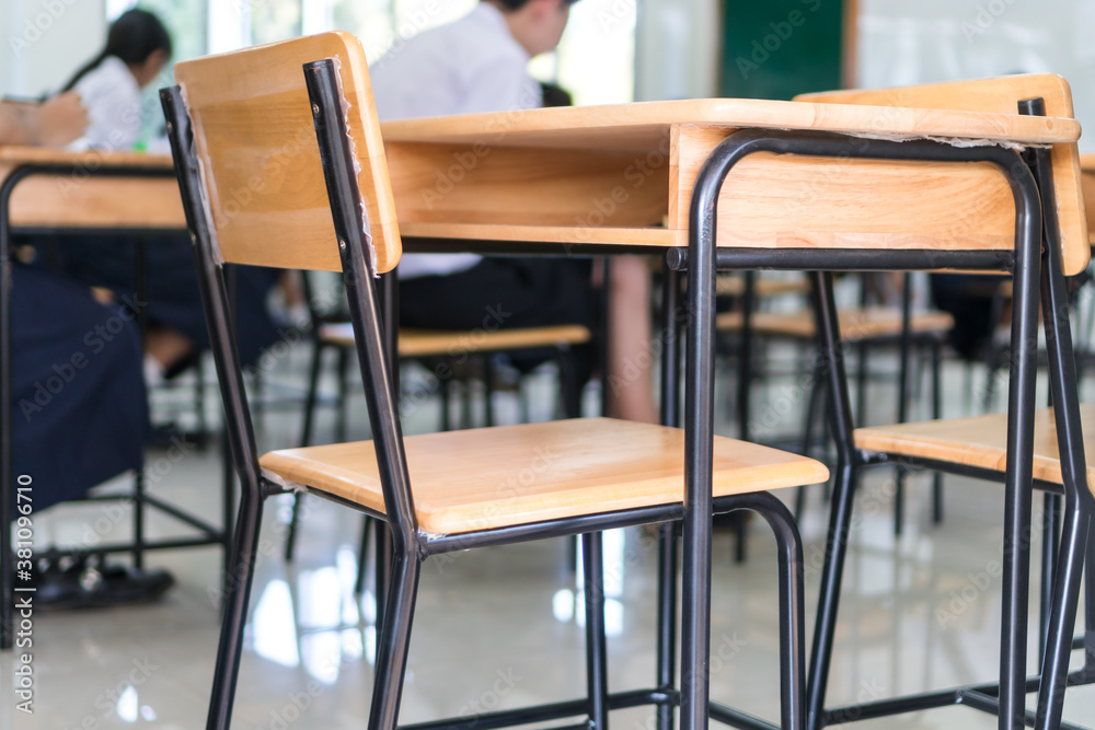 Table chairs iron wooden with young student in school classroom or ...
