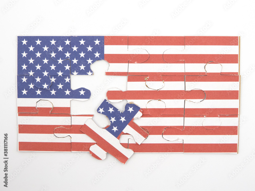 Jigsaw puzzle with picture of American flag with one piece missing in ...
