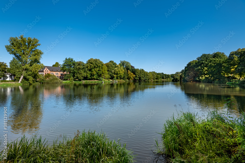 Reinbek, Germany, near Hamburg. The lake Muehlenteich and the Reinbek ...