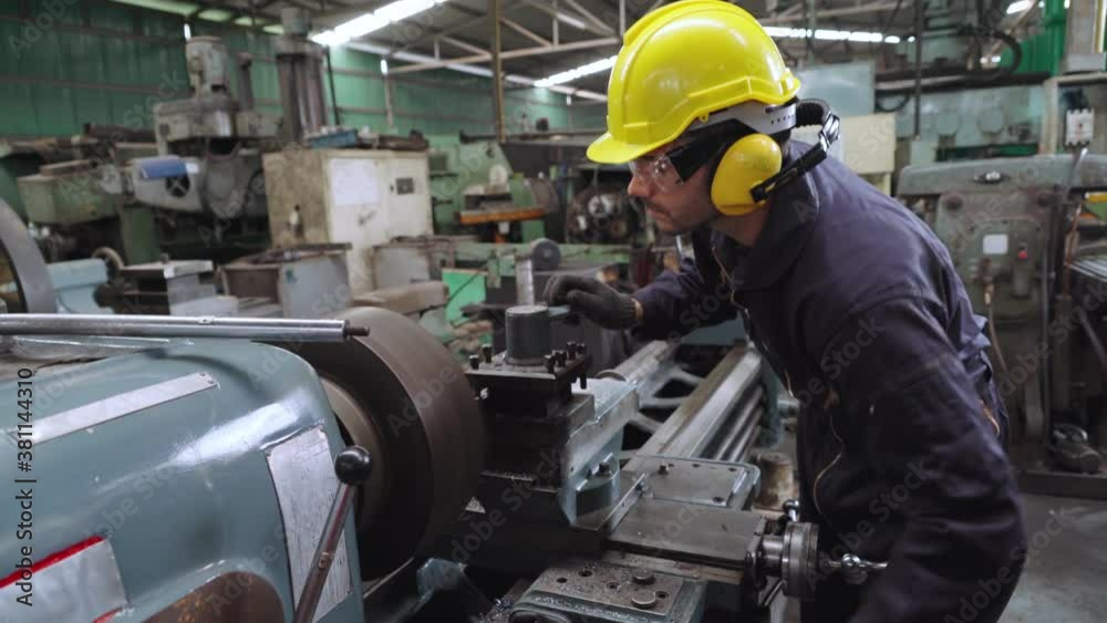 Smart factory worker using machine in factory workshop . Industry and ...