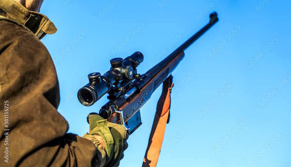 Man holds a rifle in his hands, weapon. Shooter sighting in the target ...