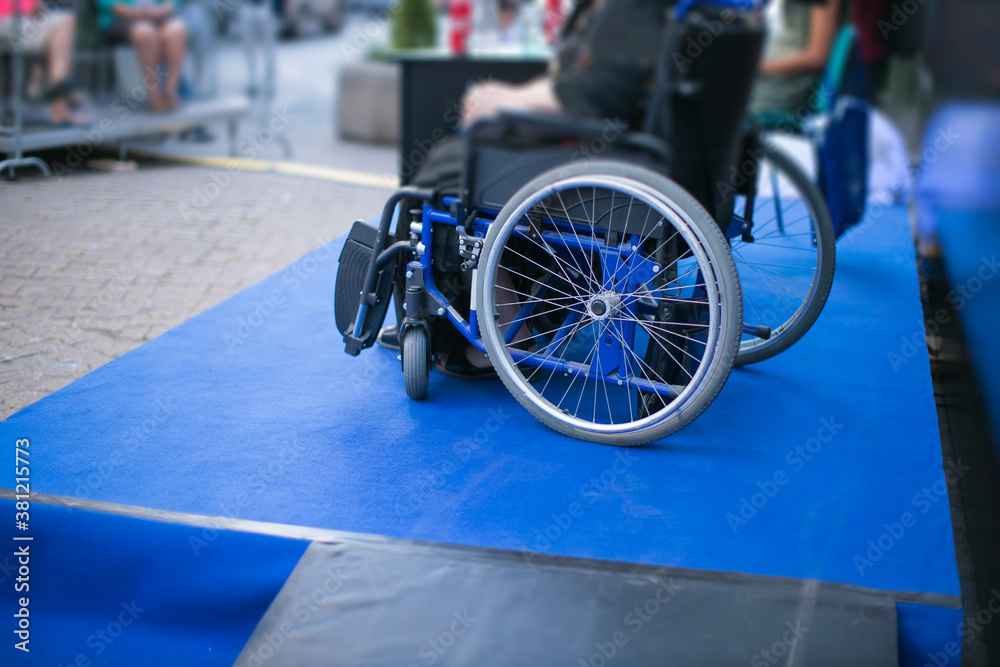 speaker with disability on podium next to access ramp Stock Photo ...
