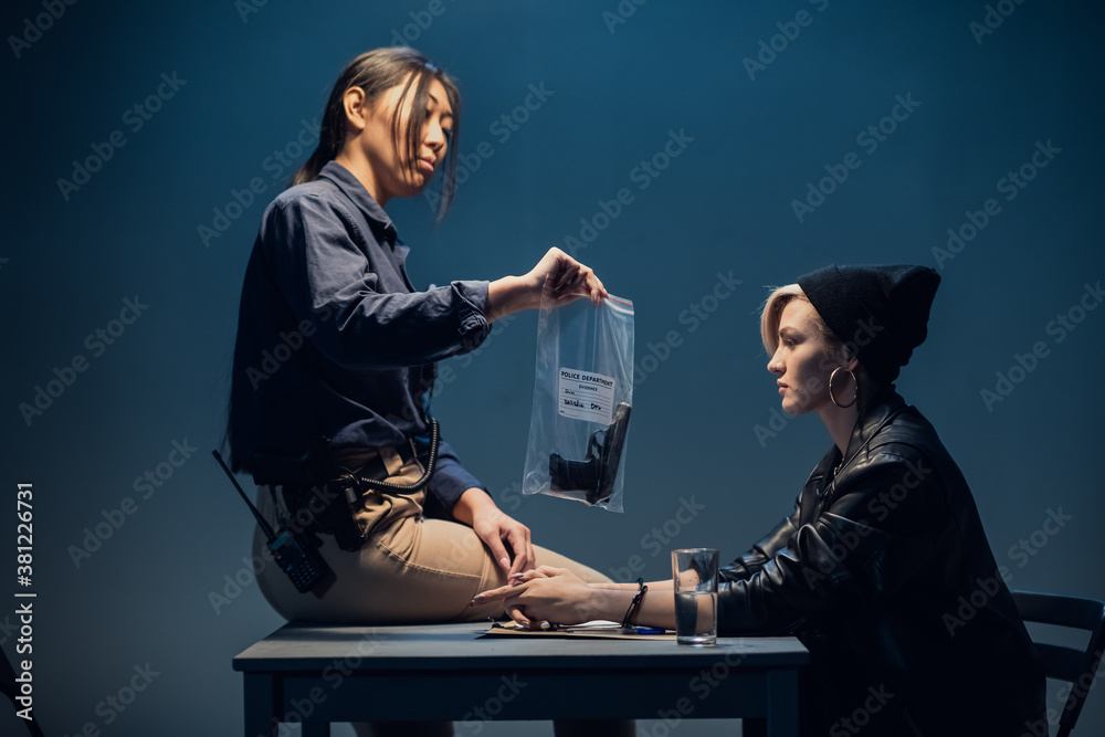 An experienced investigator during an interrogation at a police station ...