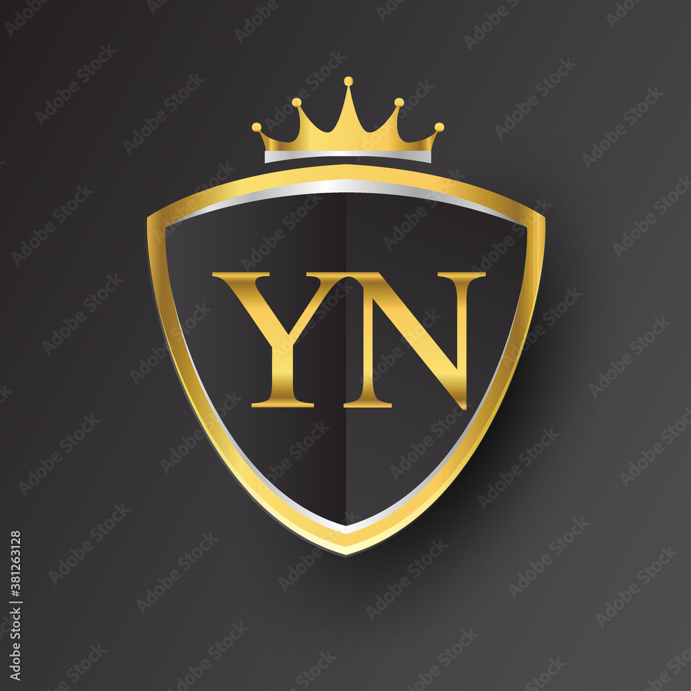 Initial logo letter YN with shield and crown Icon golden color isolated ...