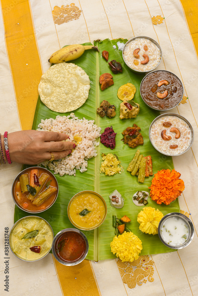 Onam sadhya, Indian women eating with hand boiled rice, served for ...