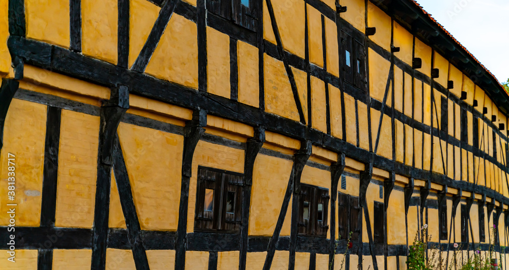 Facade of an old half timbered medieval house in northern Europe, with ...