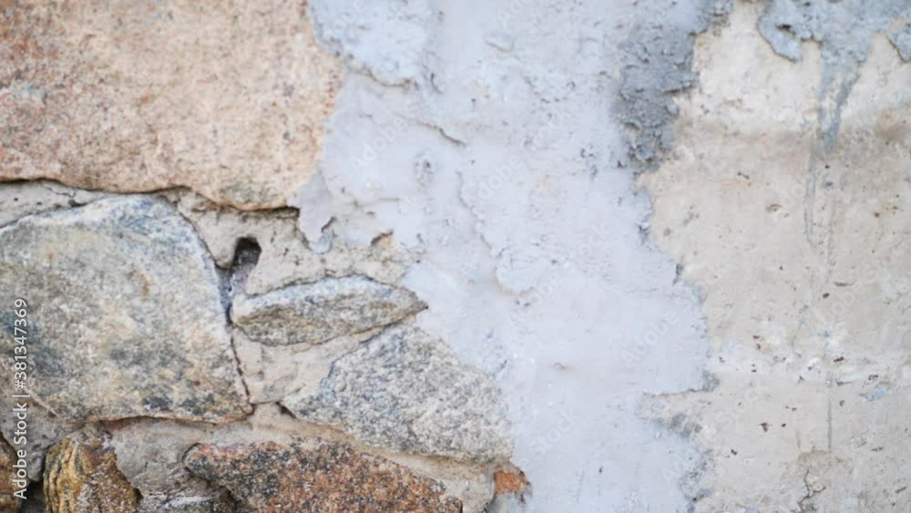 Texture of old stones of various forms with seams. Close up of shabby ...