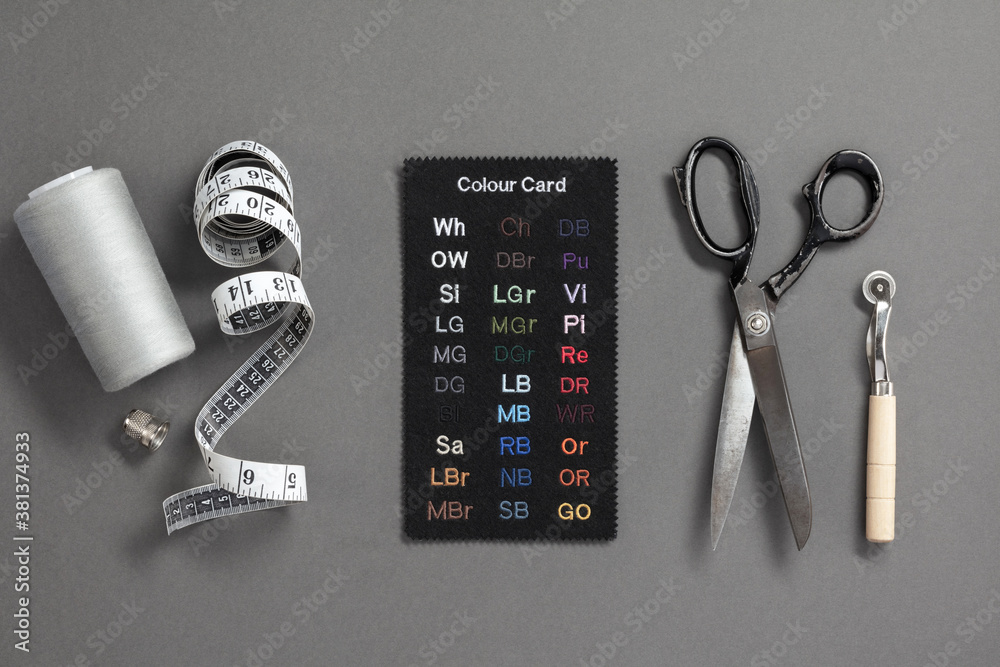 Sewing items: tailoring scissors, cutting knife, thimble, thread spool ...