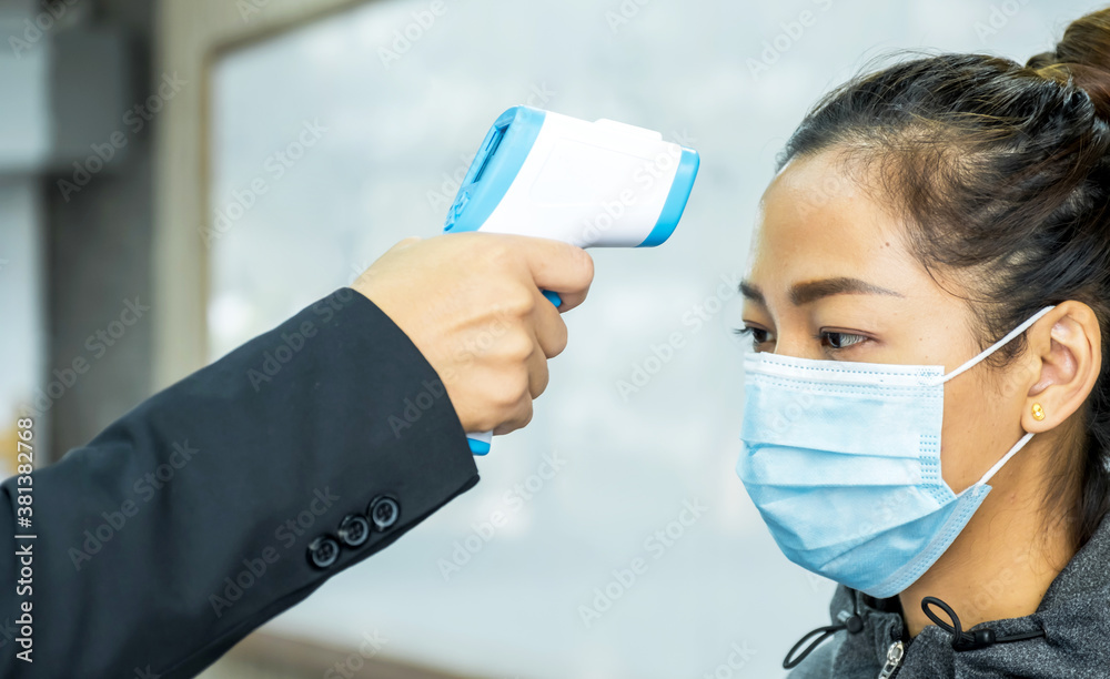 Young woman fever check by the professor before going to class. Open ...